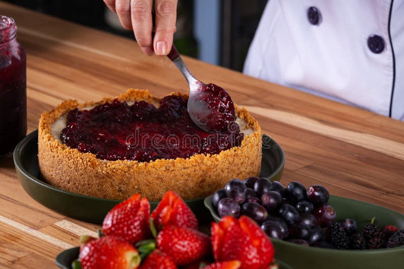 Hand with Spoon Spreading Berry Jam on Sweet Pie Stock Image - Image of ...