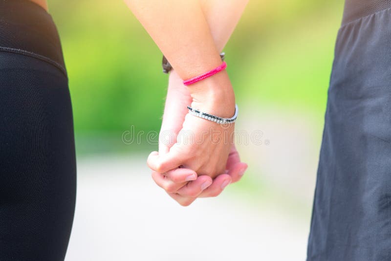 Hand in Hand of Sporty Man and Woman Stock Image - Image of strolling ...
