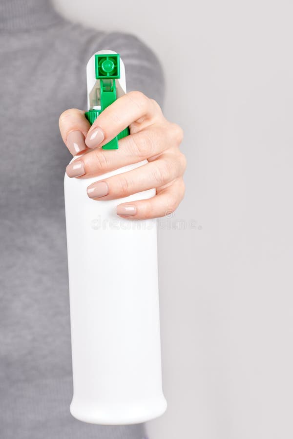 Hand with Spray Bottle on Grey Background Stock Image - Image of ...