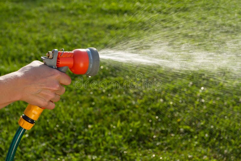 Hand with spray gun stock image. Image of nature, green - 28382281