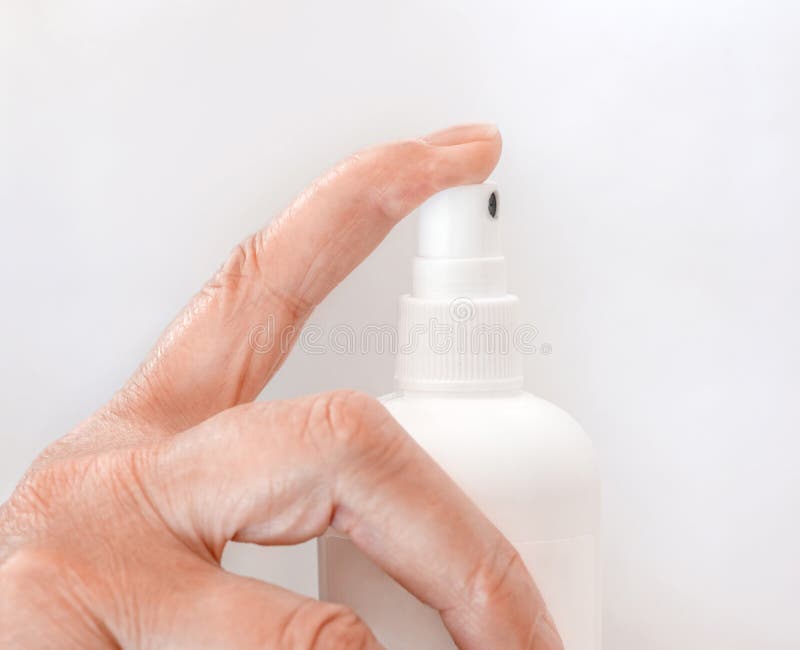 Hand on a Spray on the Top of Sprayers for Sterilization in White ...