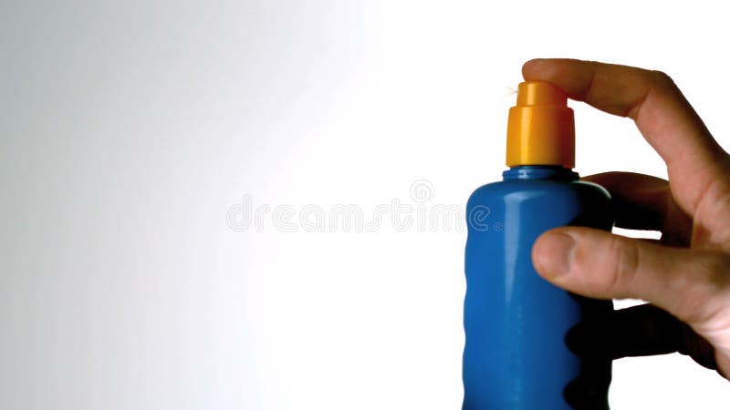 Hand Spraying Sun Cream on White Background Stock Video - Video of ...