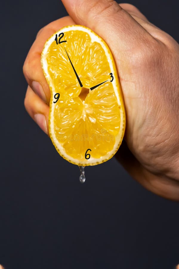 Hand Squeezes Out a Lemon, on Which the Clock is Drawn. Stock Image ...