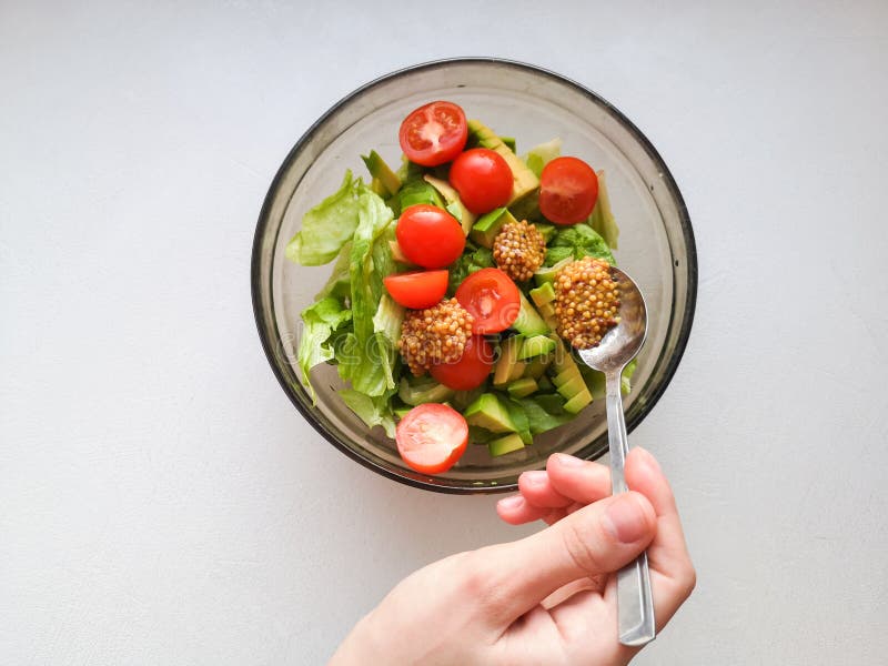 Hand is Squeezing Lime Over Vegetarian Salad is Made from Avocado ...