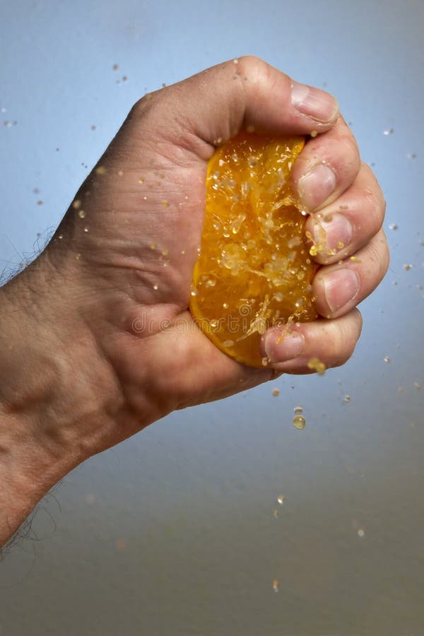 Hand Squeezing an Orange stock image. Image of healthy - 53721523