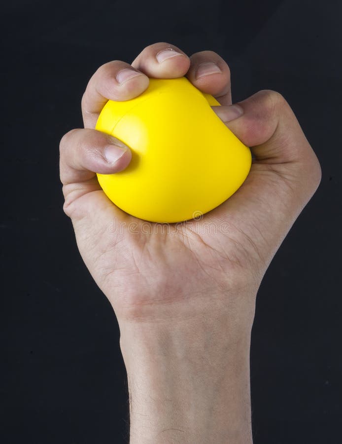 Hand Squeezing Stress Ball stock photo. Image of energy - 110903270