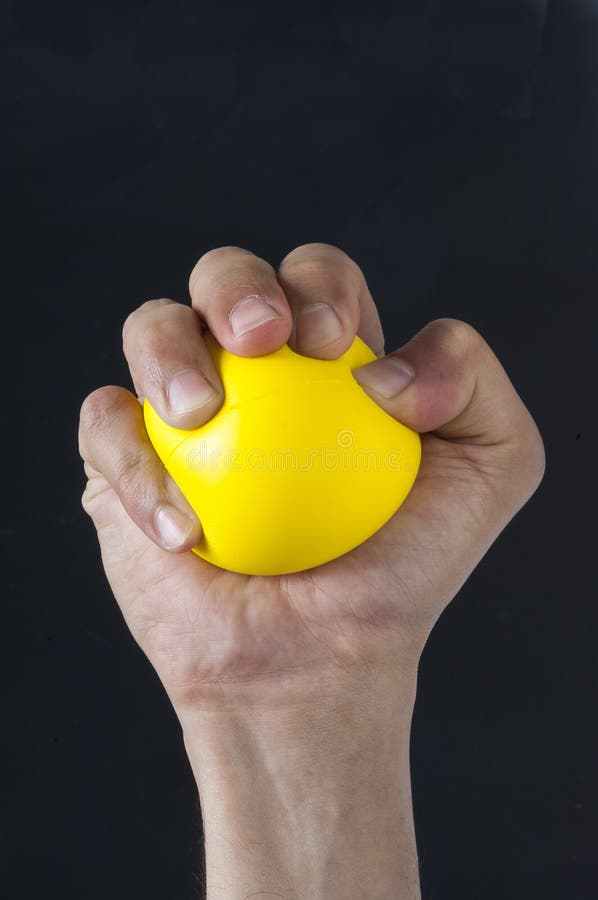 Hand Squeezing Stress Ball stock photo. Image of frustration - 110903568