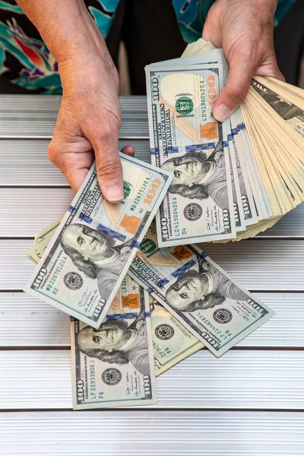 Hand with stack of money stock image. Image of senior - 257901261