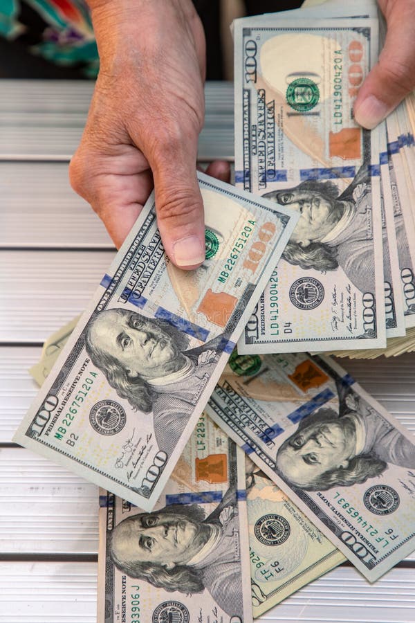 Hand with stack of money stock image. Image of negotiate - 257901269