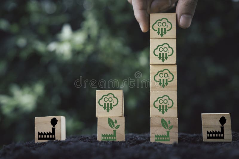 Hand Stacking CO2 Reducing Icon on Green Factory for Decrease CO2 ...