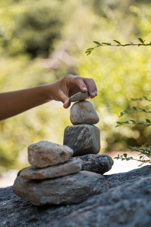 Hand Stacking Stones Outdoors Stock Photo - Image of relaxation ...