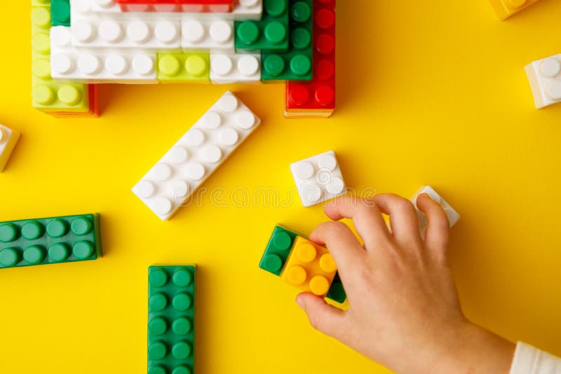 Hand Stacking Up the Colorful Plastic Block. Stock Image - Image of ...