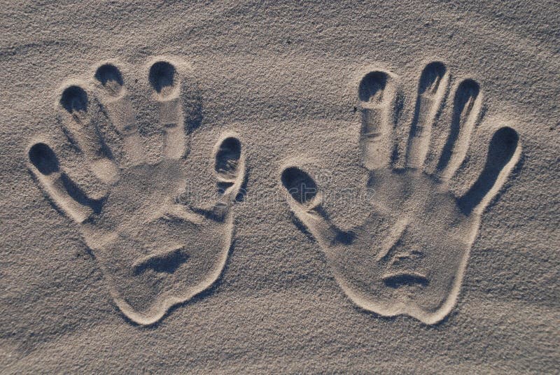 Hand stamp on the sand stock image. Image of track, child - 5267625