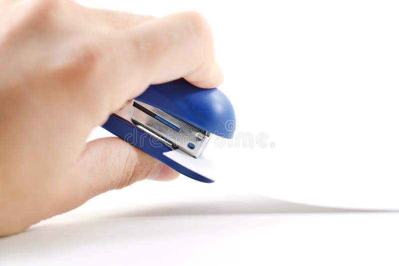 Hand Stapling Papers with a Blue Mini Stapler Stock Image - Image of ...