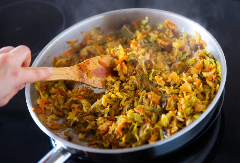 Hand Stirring Chopped Cabbage in Pan Stock Photo - Image of product ...
