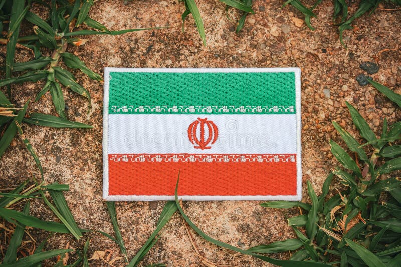 Hand-stitched Iranian Flag on Rustic Stone with Greenery. Concept of ...