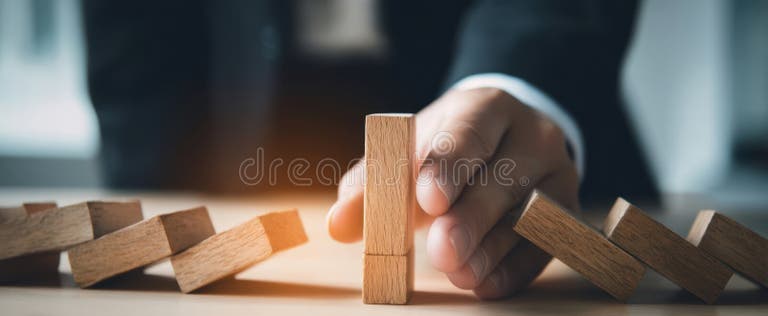 The Hand Stopping Falling Blocks in a Business Strategy Scenario.AI ...