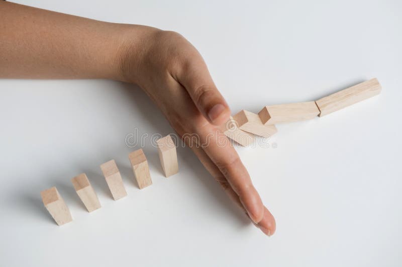 Hand Stopping or Preventing a Falling Block. Concept of Hedging, Risk ...