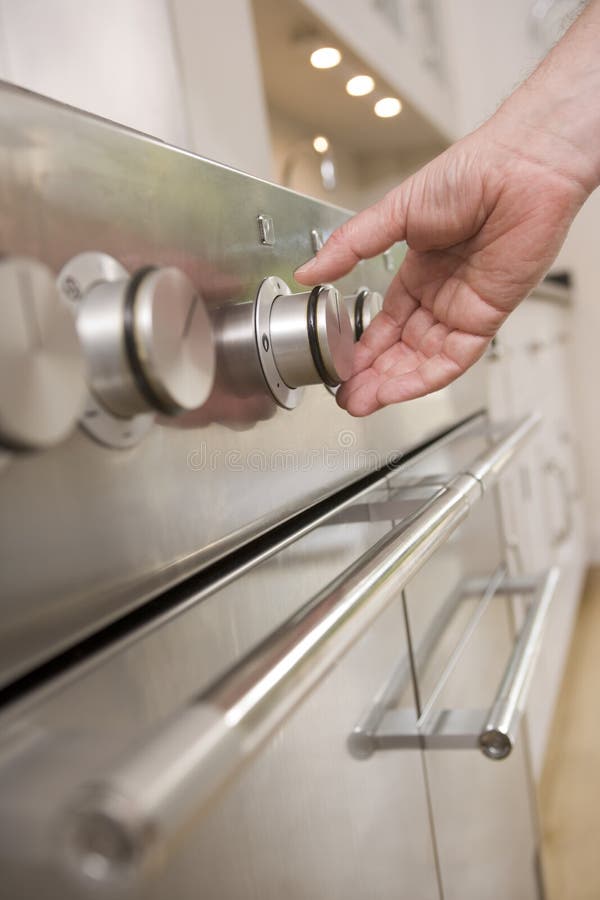 Hand on Stove Dial in Kitchen Stock Photo - Image of caucasian, home ...