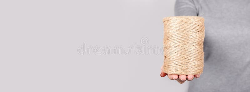 Hand with String Roll on Grey Background Stock Photo - Image of grey ...