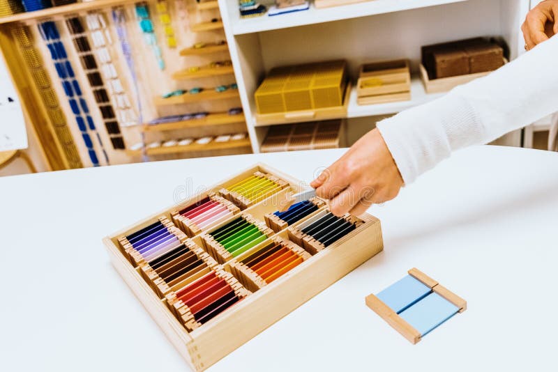 Hand of a Student Handling Montessori Material Inside a Classroom Stock ...