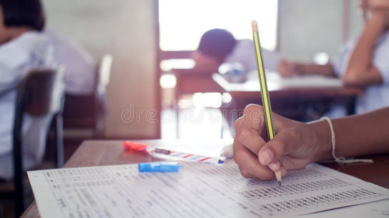 Hand of Students Writing and Taking Exam with Stress in Classroom.16:9 ...