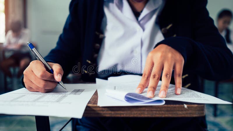 Hand of Students Writing and Taking Exam with Stress in Classroom Stock ...
