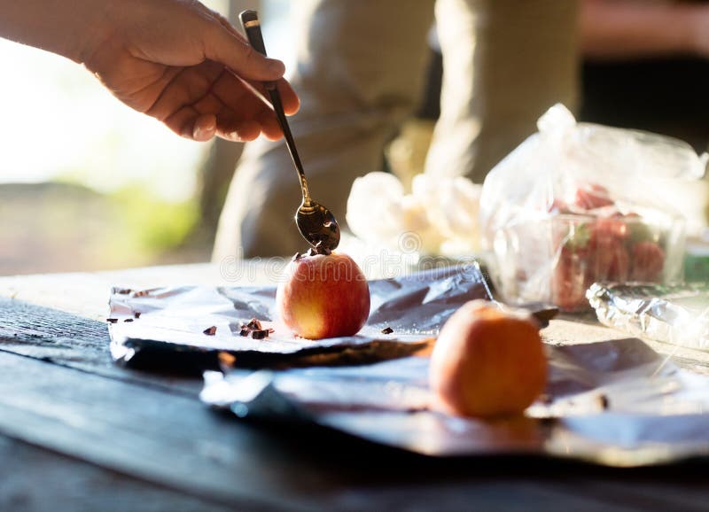 Hand Stuffing Chocolate Chips into Apple Stock Photo - Image of evening ...