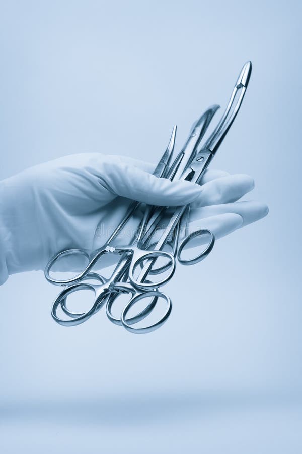 Surgeon hand with scalpel stock photo. Image of care - 18130864