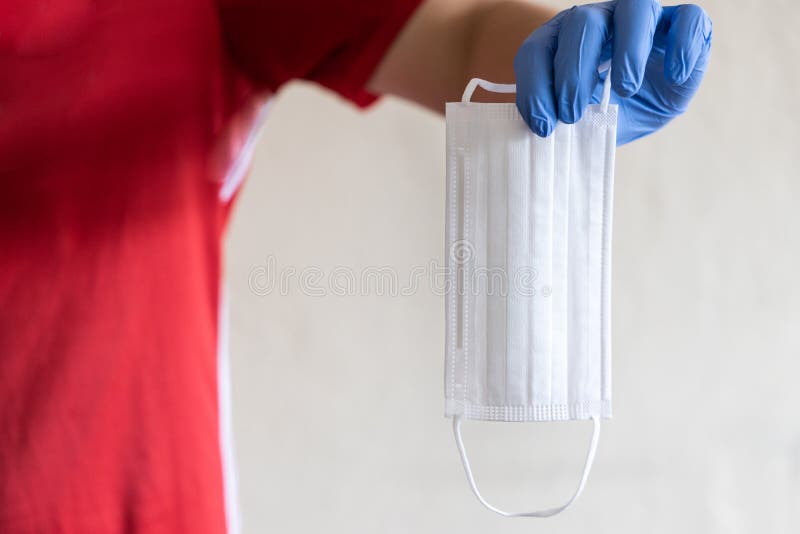 Hand with Surgical Gloves Holding Face Mask Stock Photo - Image of ...