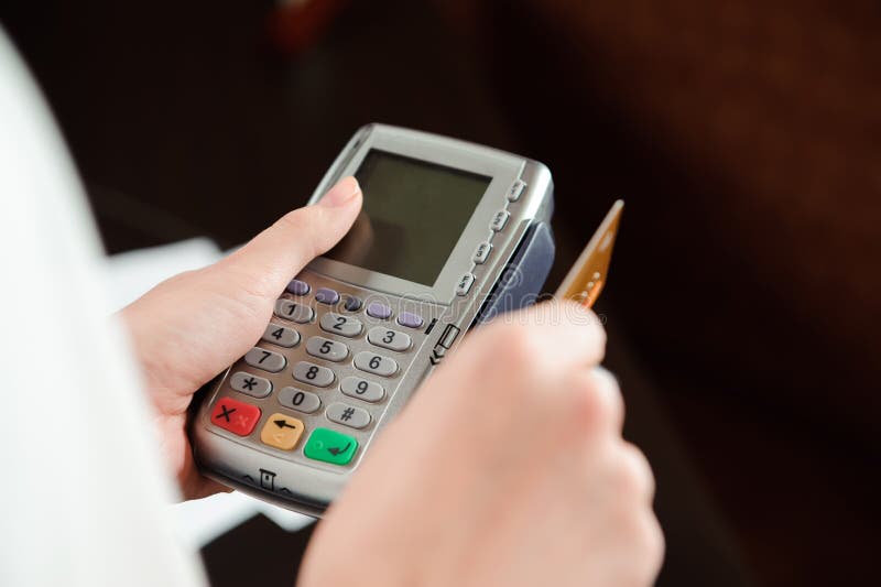 Hand Swiping Debit Card on Pos Terminal, Business People in Office ... Hand Swiping Debit Card on Pos Terminal, Business People in Office ...