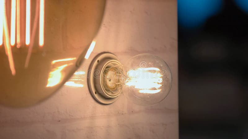 Hand Switches Off Light Bulb on the Wall. Stock Image - Image of idea ...