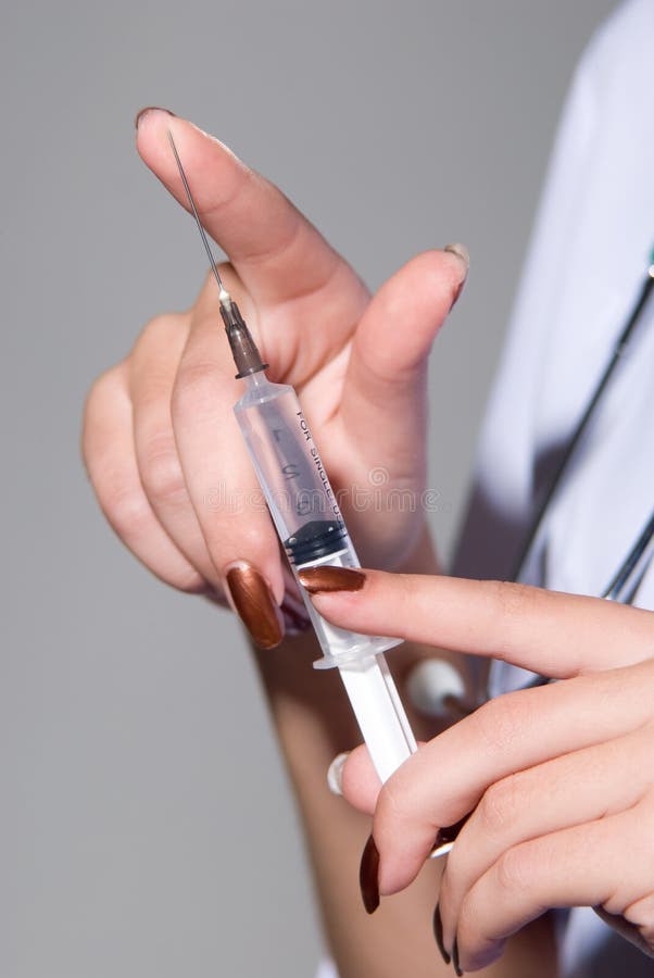 Hand with a syringe stock photo. Image of injection, person - 27368358