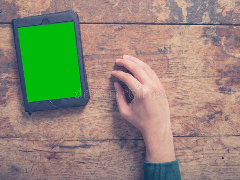 Hand and Tablet Computer on Wooden Table Stock Image - Image of ...