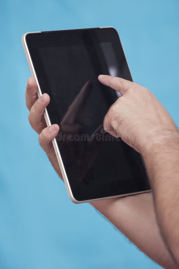 Hand wih digital tablet stock photo. Image of indoors - 25800714