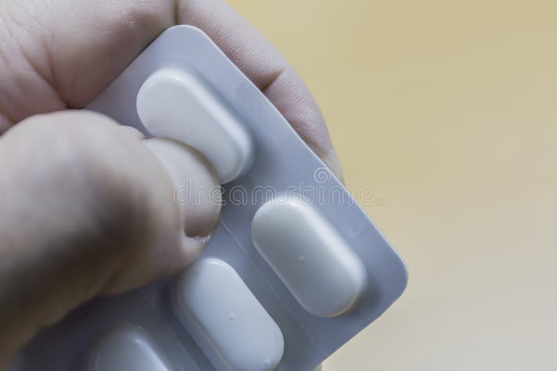 Hand with tablets stock image. Image of pharmaceutical - 84960687