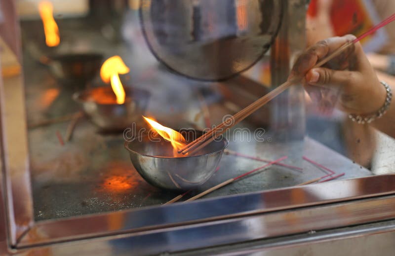 Hand take a fire incense stock image. Image of pray - 140179641