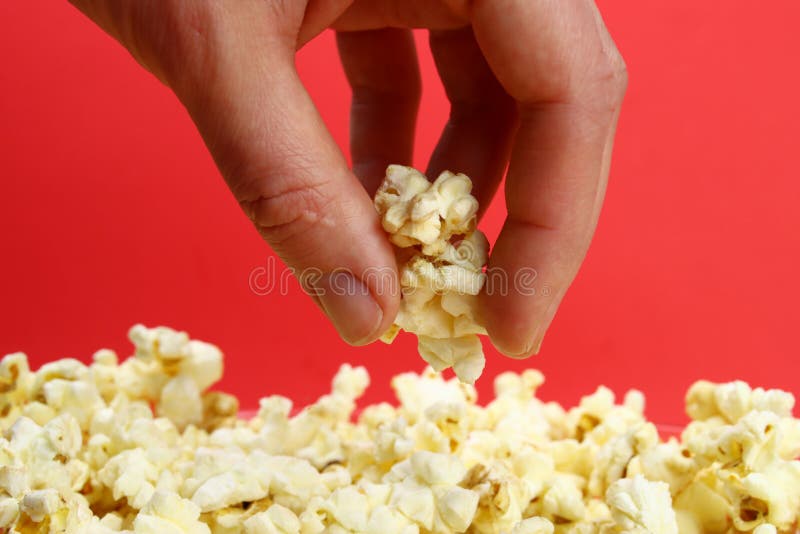 Hand Takes Popcorn from a Paper Box Stock Image - Image of stripes ...