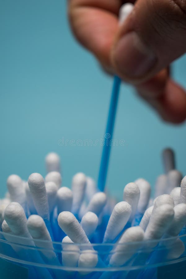 Hand Taking a Blue Cotton Swab Stock Photo - Image of medical, hand ...