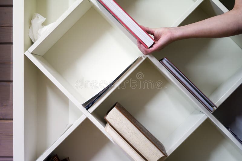 Hand Taking a Book from a Bookshelf Stock Photo - Image of picking ...