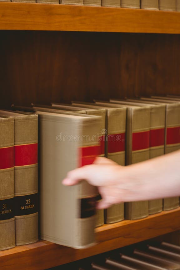 Hand Taking a Book from Bookshelf Stock Image - Image of shelf ...