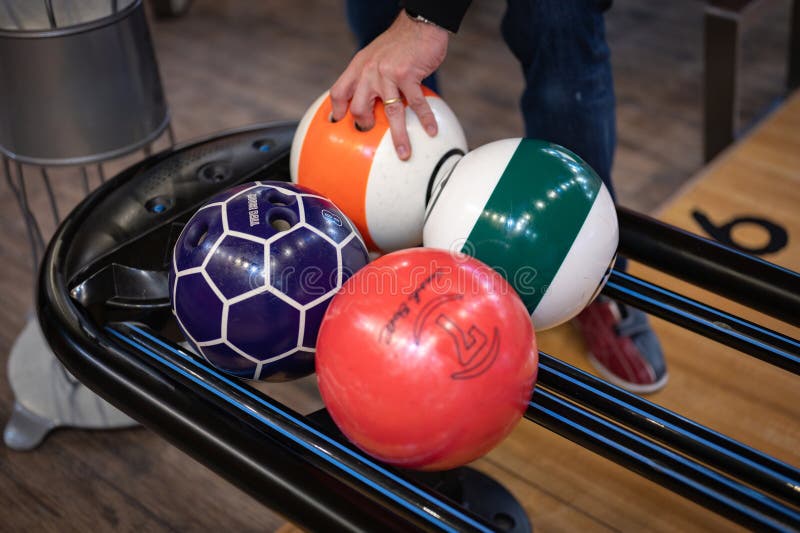 Hand Taking a Bowling Ball from the Machine. Stock Image - Image of ...