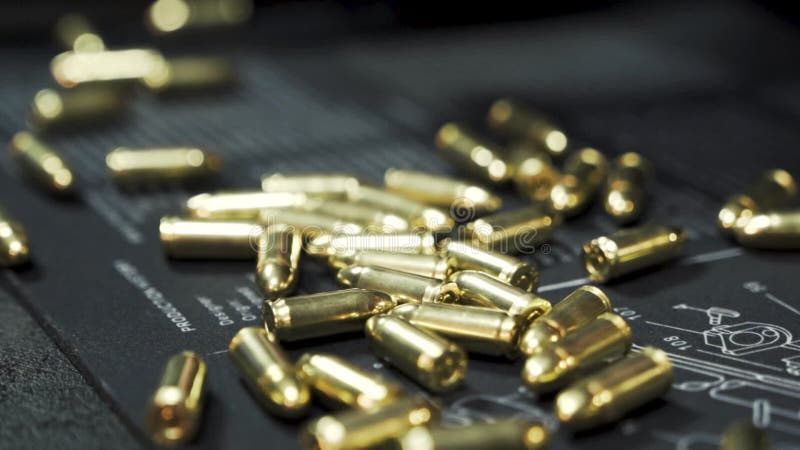 Hand is Taking a Cartridge and Loading the Magazine of an Automatic ...