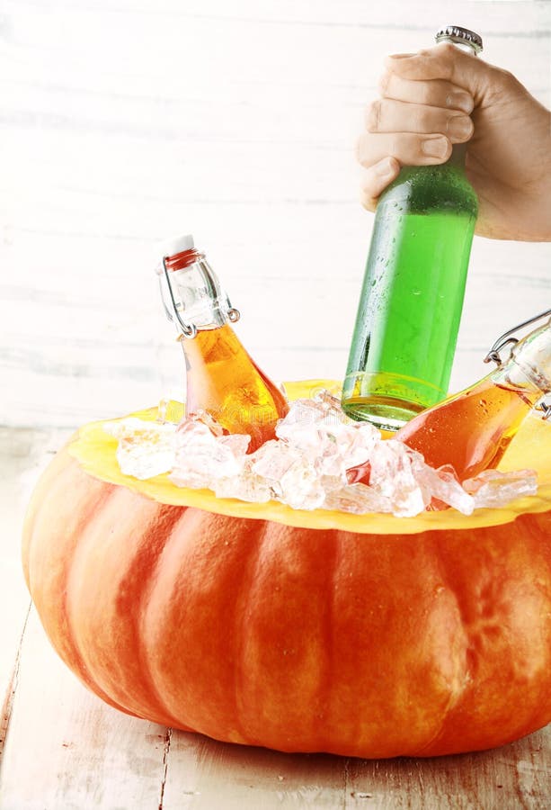 Hand Taking Cold Drink from Pumpkin Ice Bucket Stock Photo - Image of ...
