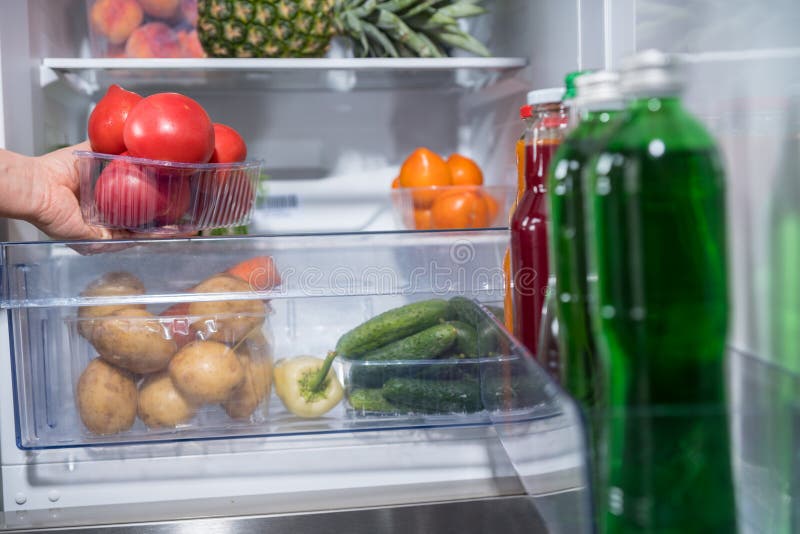 Hand Taking Container with Tomatoes from Fridge Stock Photo - Image of ...