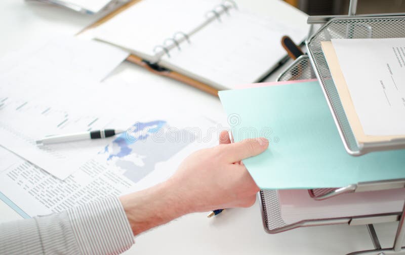 Hand taking documents stock image. Image of organized - 44615199
