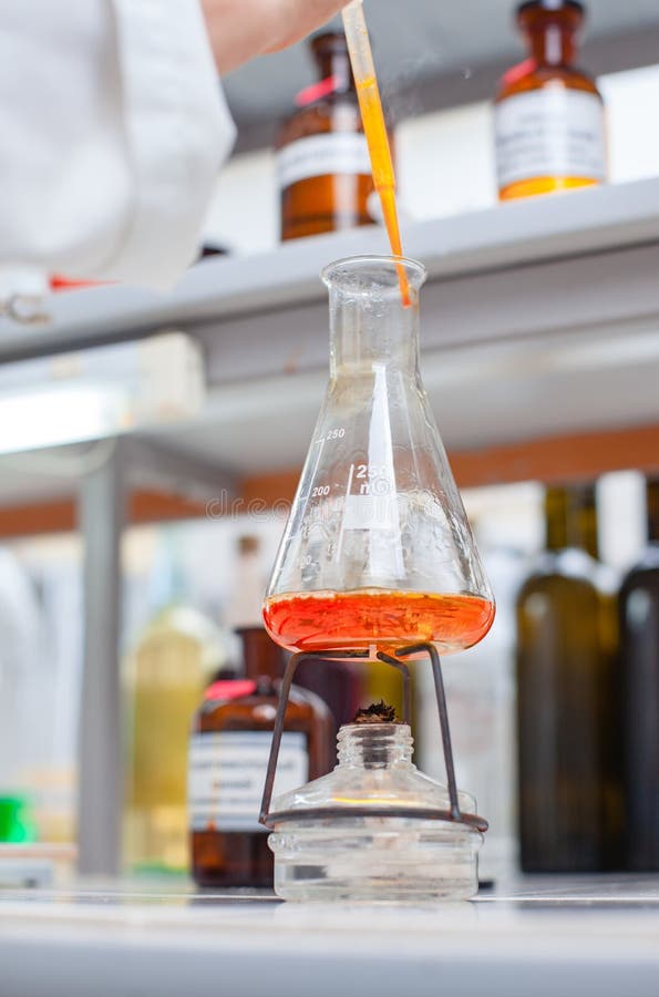 Hand Taking Drop from Flask Stock Photo - Image of development ...