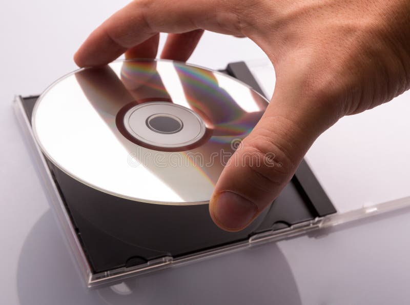 Hand taking DVD disc stock image. Image of audio, movies - 35282395