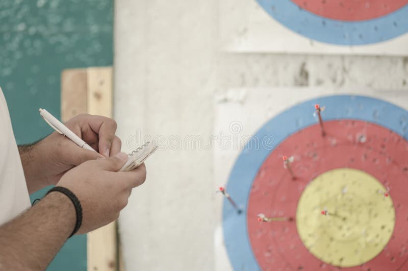 Hand Taking Note Against an Archery Target Stock Image - Image of sport ...