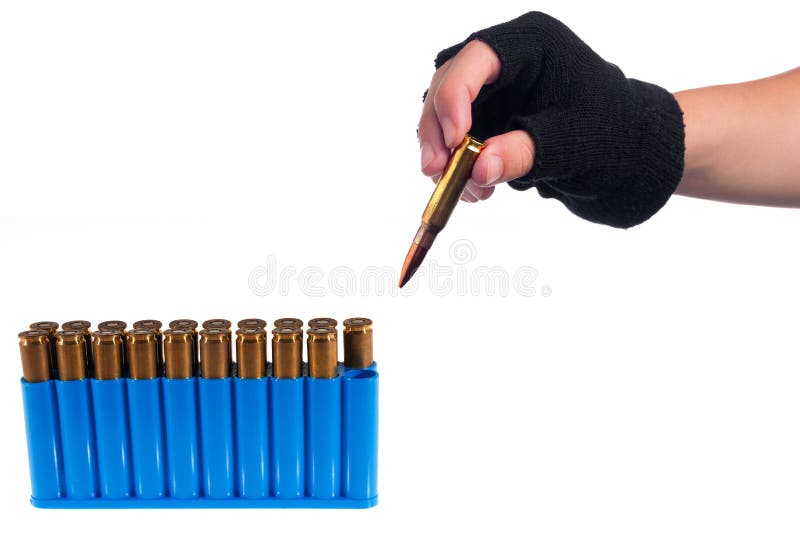 Hand taking out bullet stock image. Image of polished - 49408419